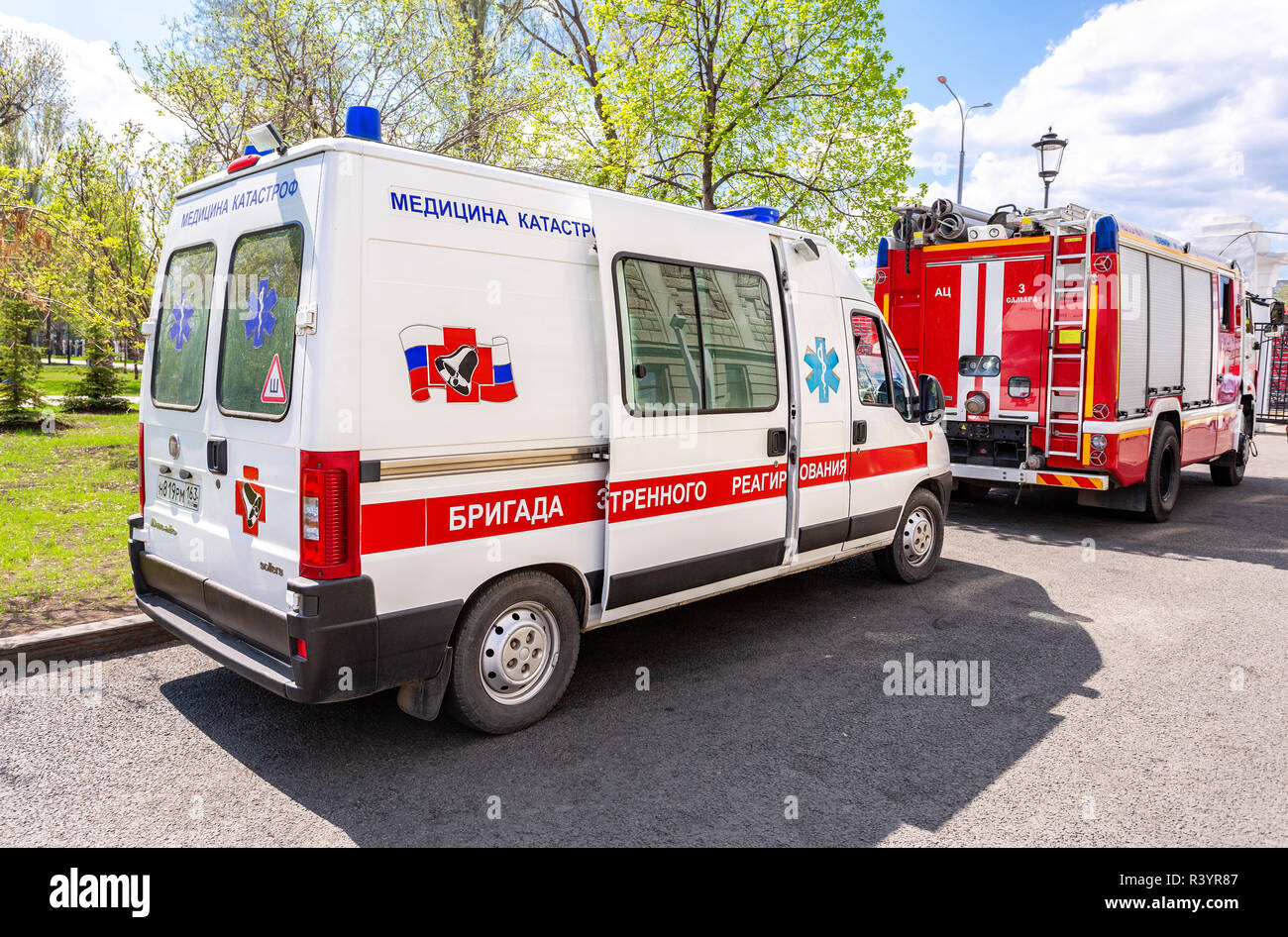 Samara, Russia - May 9, 2018: Ambulance car and fire truck parked up at ...