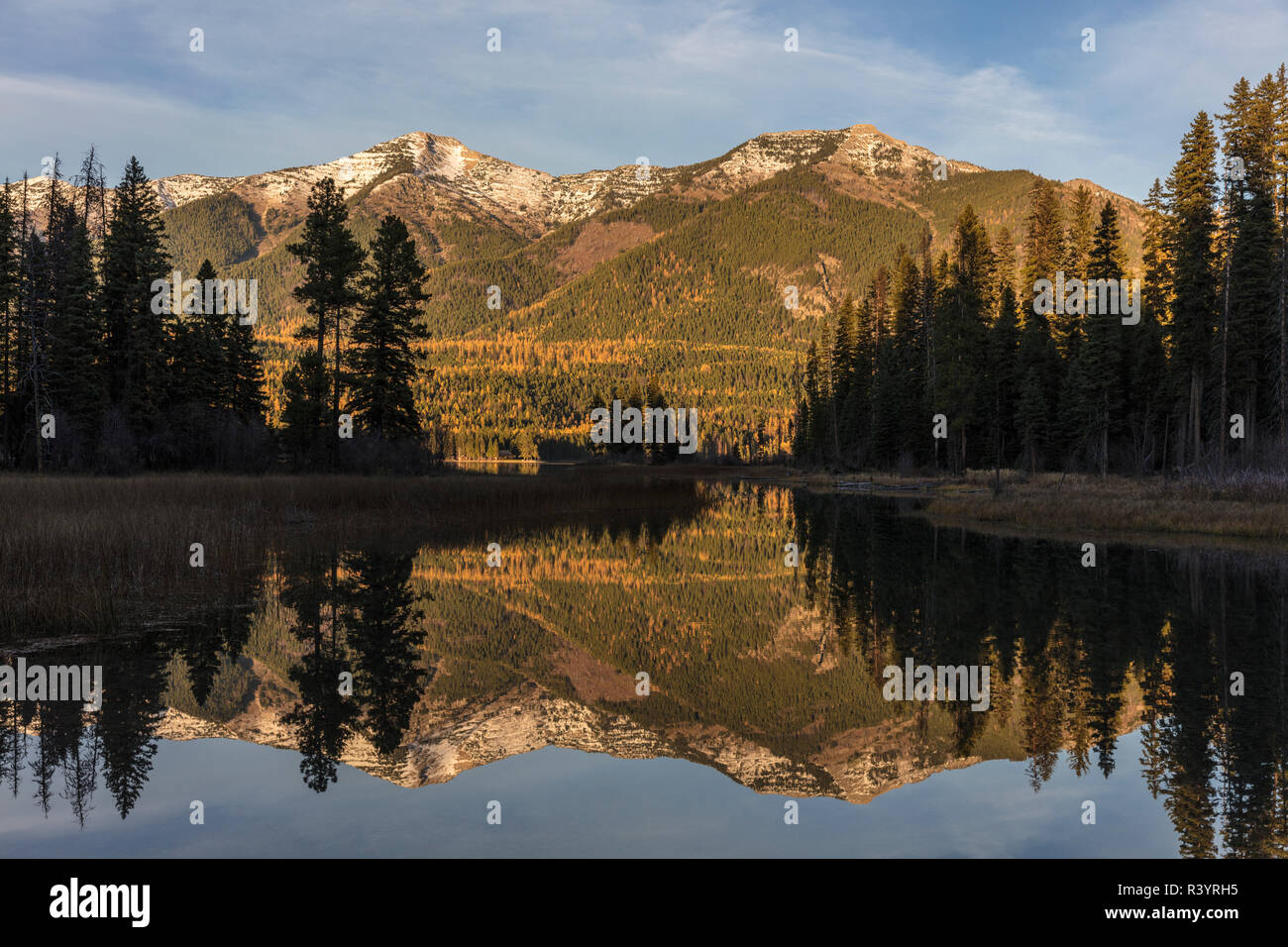 Swan Mountains reflecting into Holland Lake in the Flathead National ...