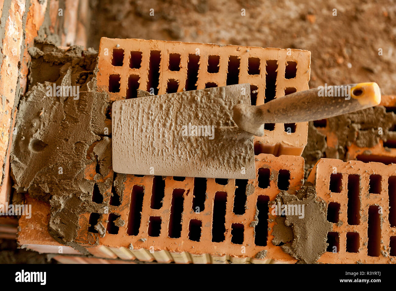 Bricklaying of walls in a high-rise building. Interior and exterior ...