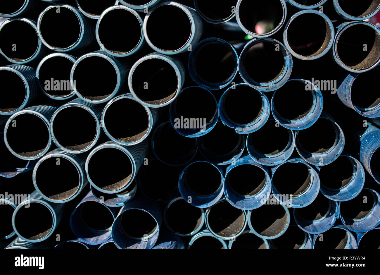 Dark blue color lue water pipes in view Stock Photo - Alamy