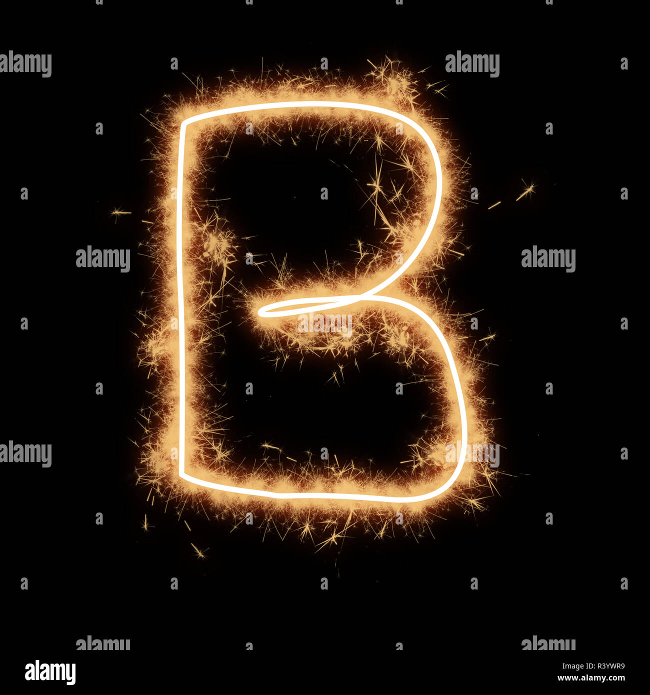 Letter B of alphabet written by squib sparks on a black background ...