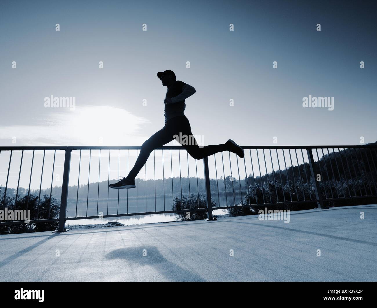 Running athlete man, side full body view. Male runner sprinting during ...