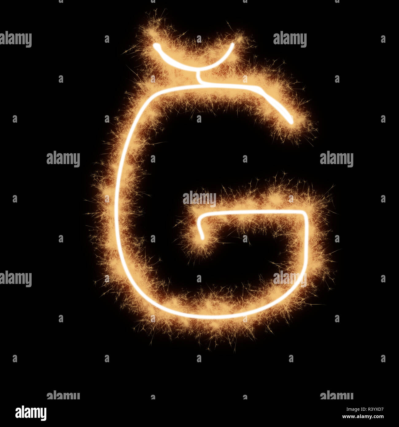 Soft letter of Turkish alphabet written by squib sparks on a black ...