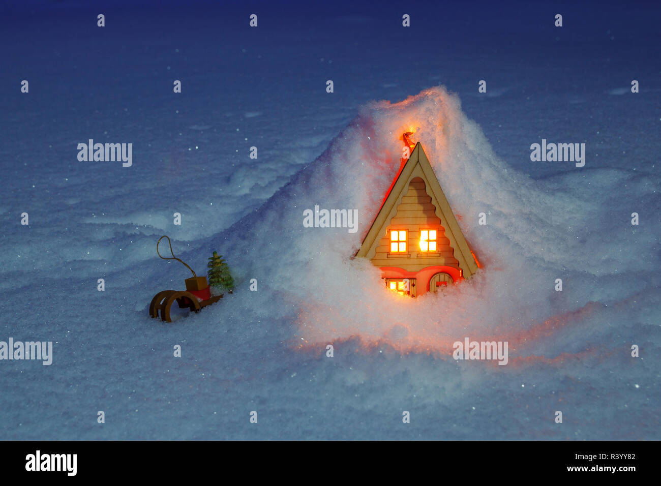 Toy house covered with snow Stock Photo - Alamy