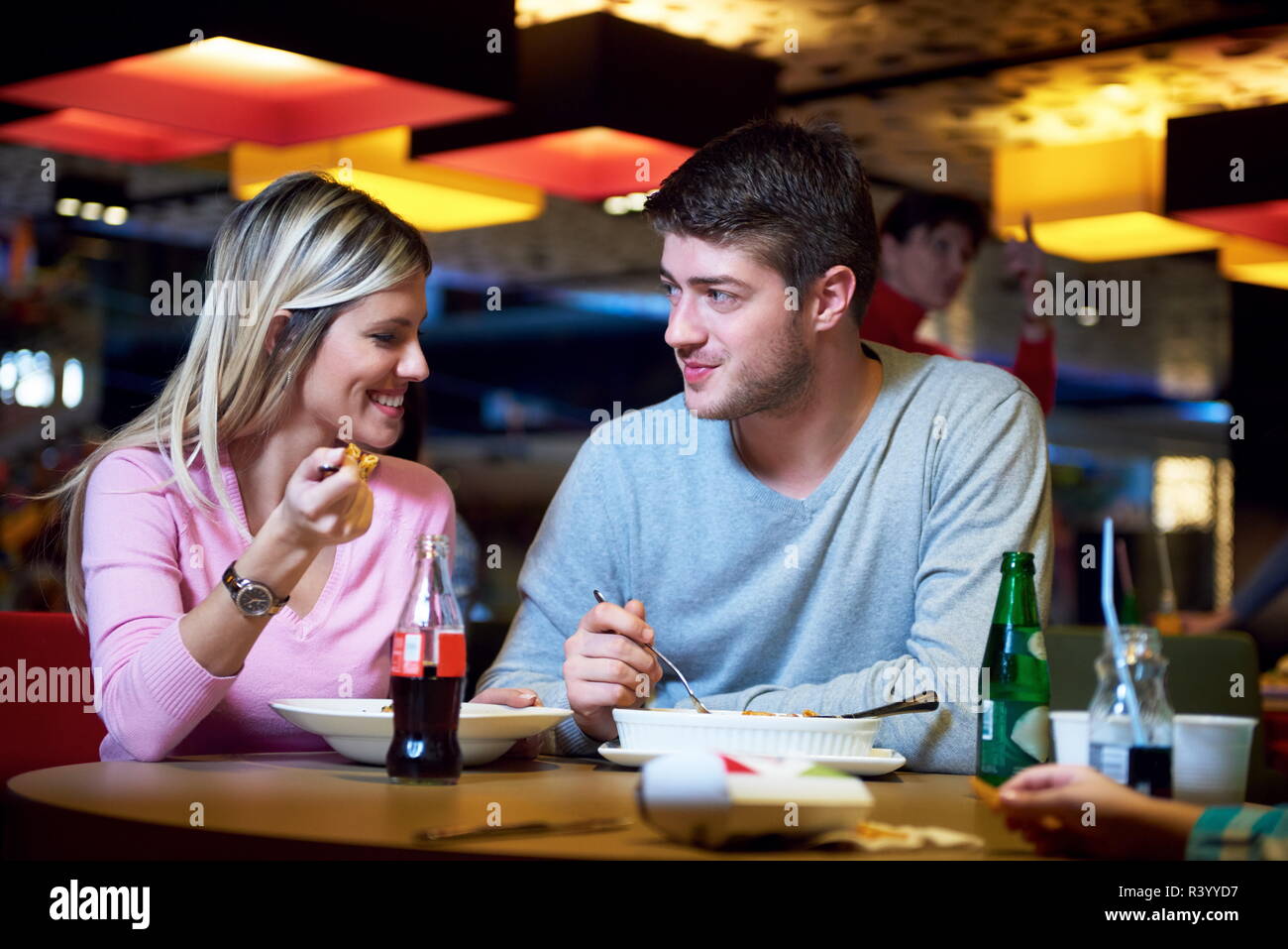 couple having lunch break in shopping mall Stock Photo - Alamy