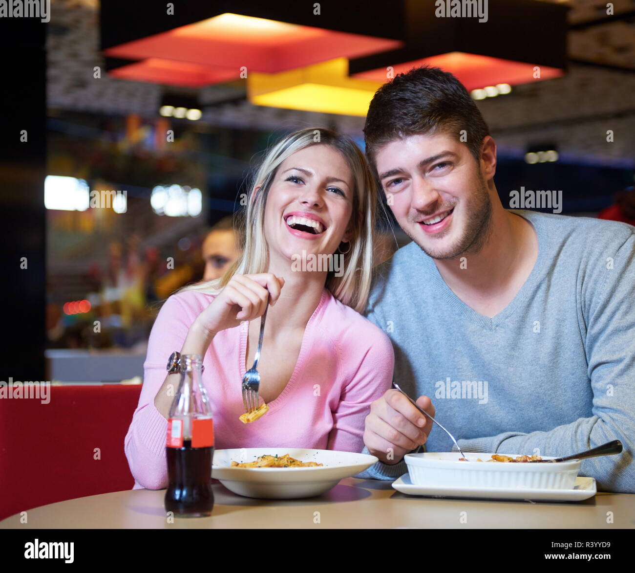 couple having lunch break in shopping mall Stock Photo - Alamy