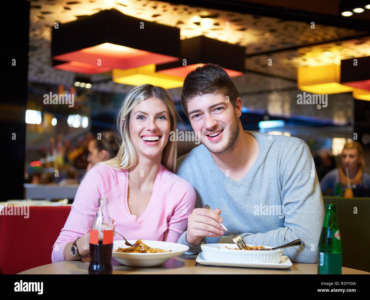 couple having lunch break in shopping mall Stock Photo - Alamy