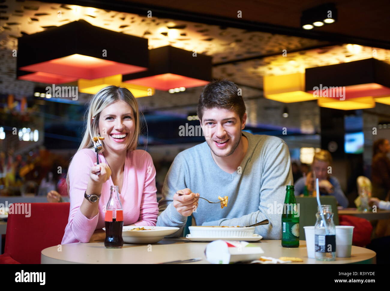 couple having lunch break in shopping mall Stock Photo - Alamy