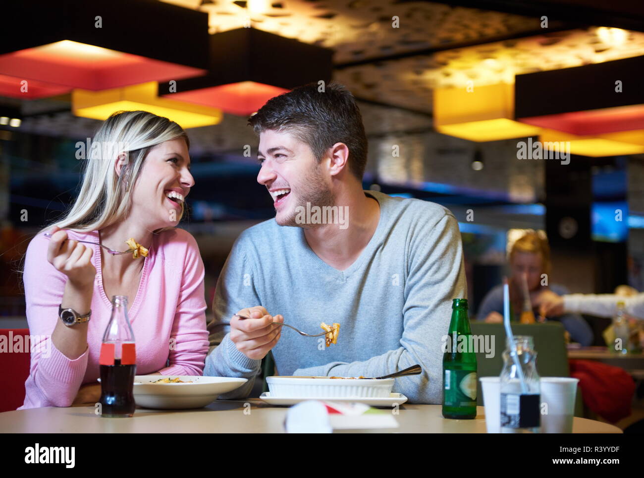 couple having lunch break in shopping mall Stock Photo - Alamy