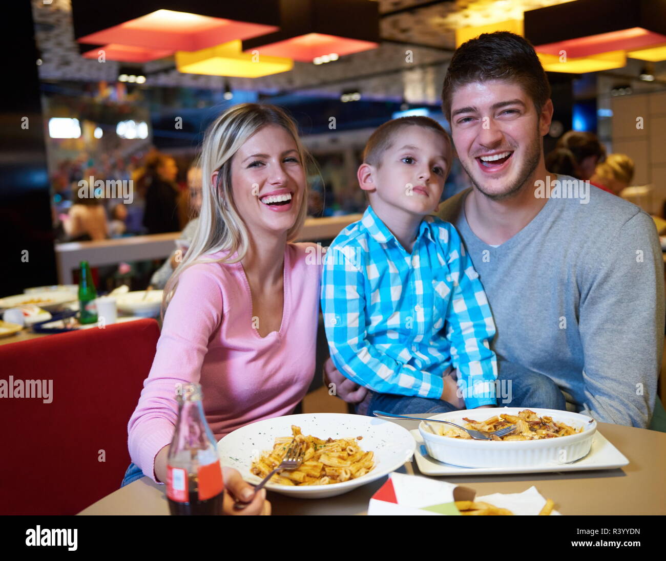 family having lunch in shopping mall Stock Photo - Alamy