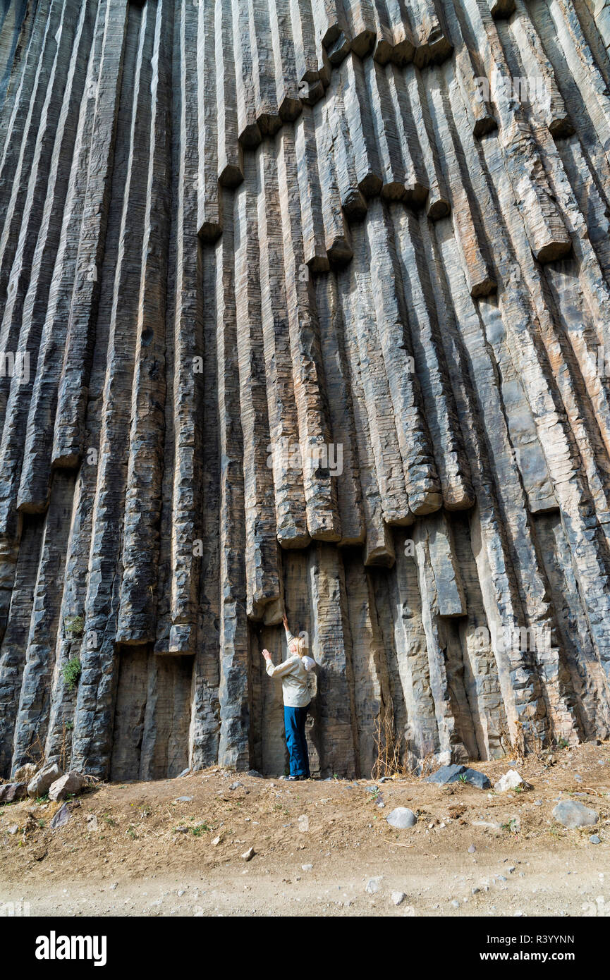 Symphony of Stones, Woman under the basalt columns formation along ...