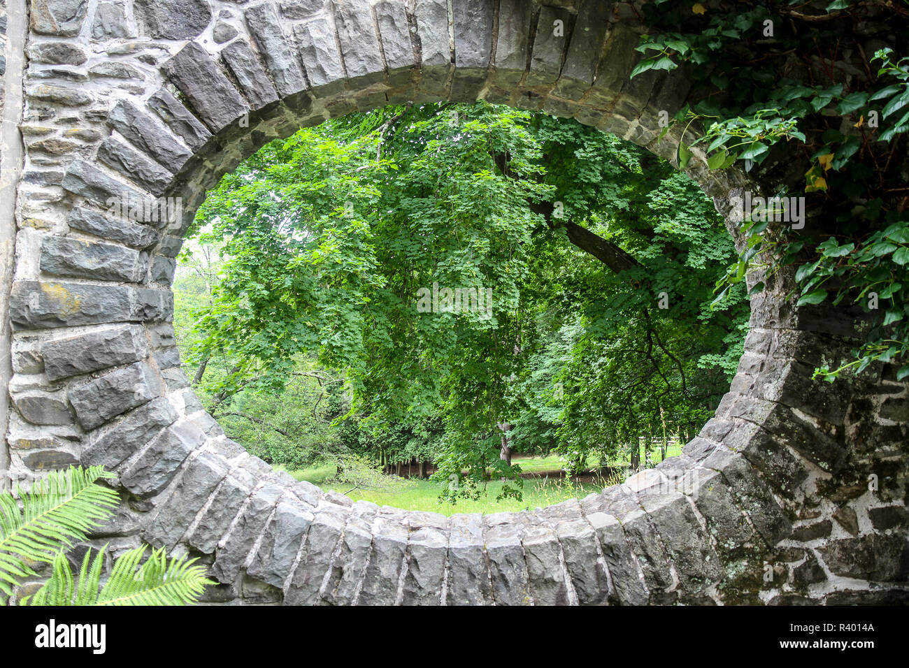 View Of Greenery Through A Stone Window In The Gardens Of Grey Towers ...