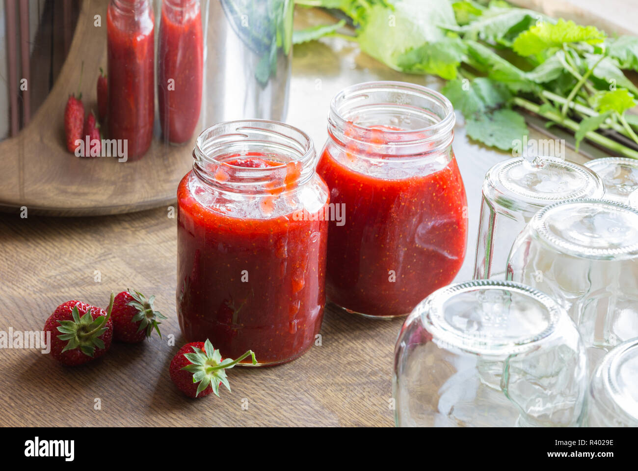 strawberry jam cooking filling of jam Stock Photo - Alamy