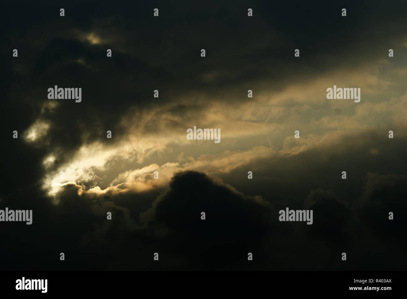 Sun shines through rain clouds hi-res stock photography and images - Alamy