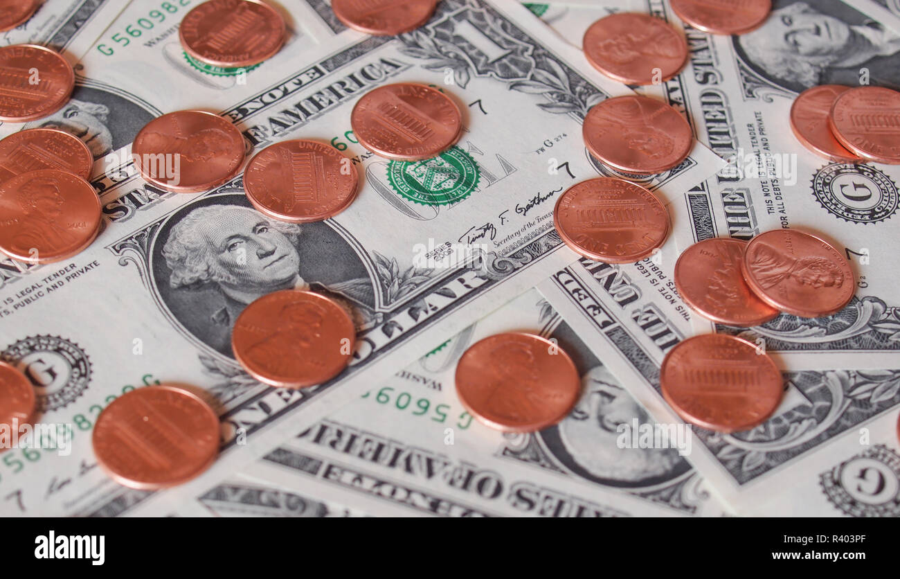 Dollar coins and notes Stock Photo - Alamy