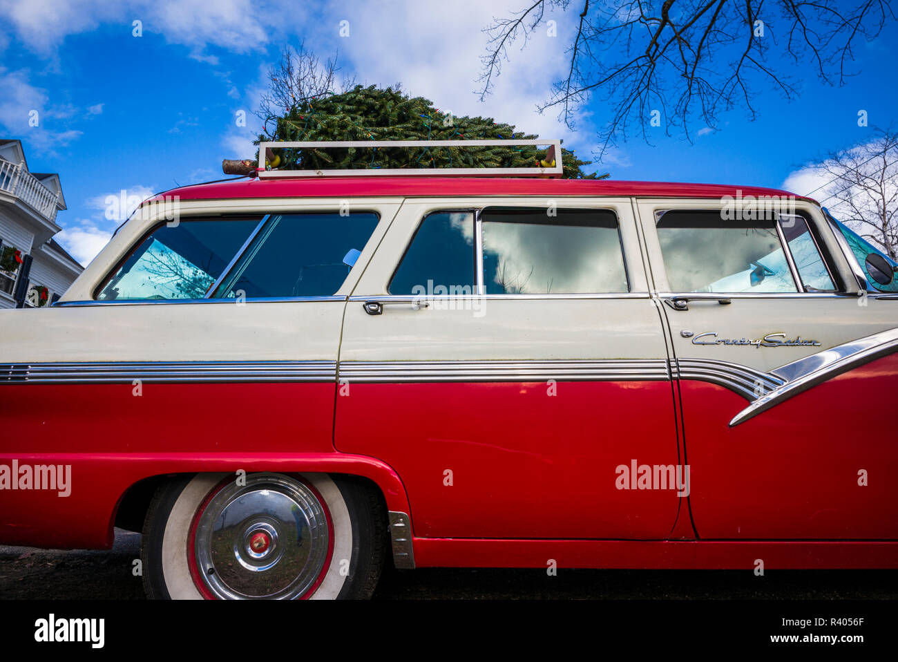 USA, Maine, Kennebunkport, 1950's Ford station wagon carrying a ...