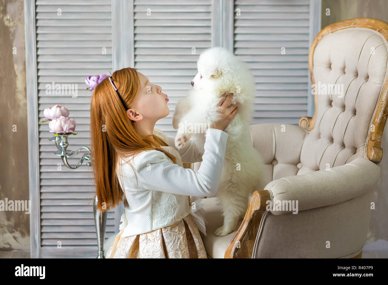 Portrait of ginger hair girl play with husky poppy.Model girl with red ...