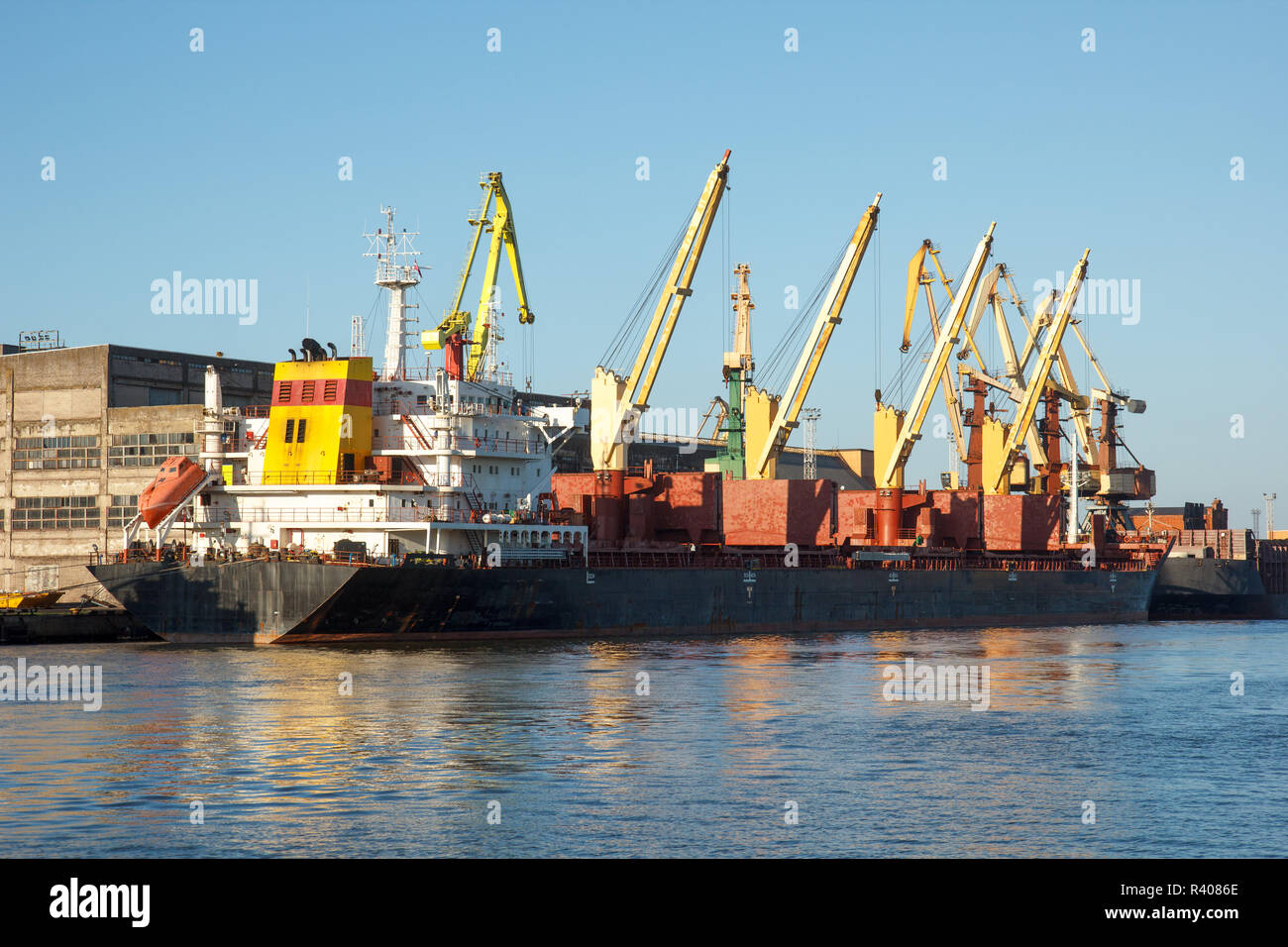 Ship in a harbor Stock Photo - Alamy