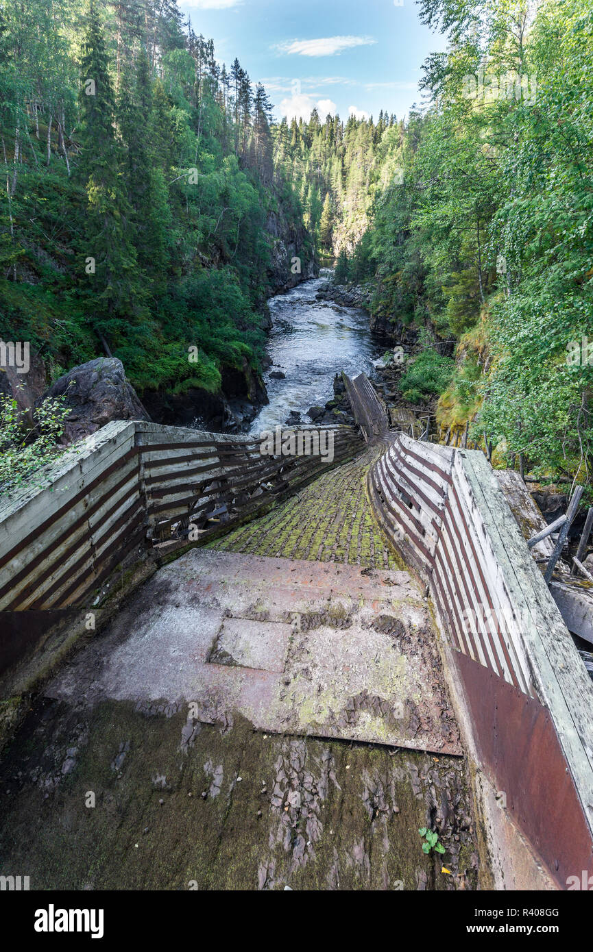 Old chute for transporting timber over the dam along the river ...