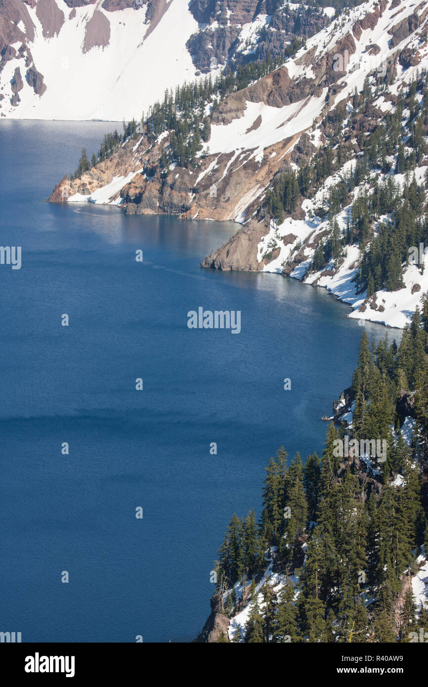 USA, Oregon, Crater Lake. Springtime snow lines crater rim Stock Photo ...