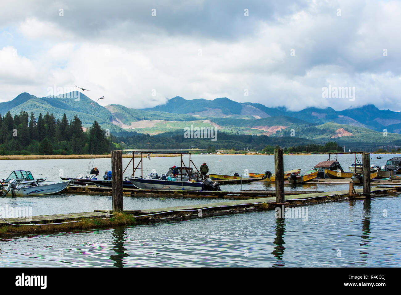 Wheeler, Oregon. Fisherman working on their fishing boats on the ...