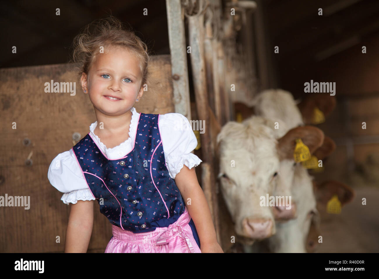 little girl child in the barn on the farm Stock Photo - Alamy