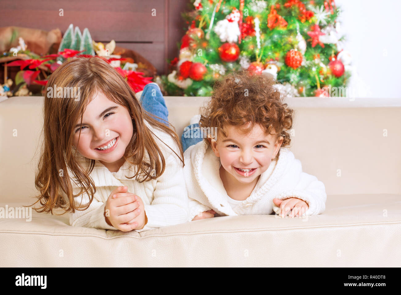 Happy kids in Christmas eve Stock Photo - Alamy