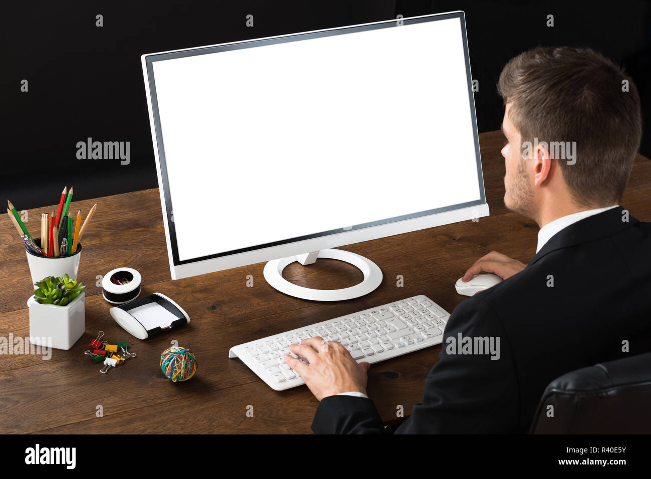 Young businessman pencil desktop hi-res stock photography and images ...