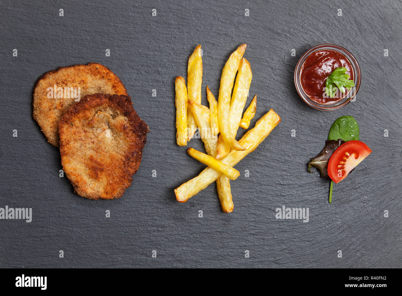 wiener schnitzel on a slate plate Stock Photo - Alamy