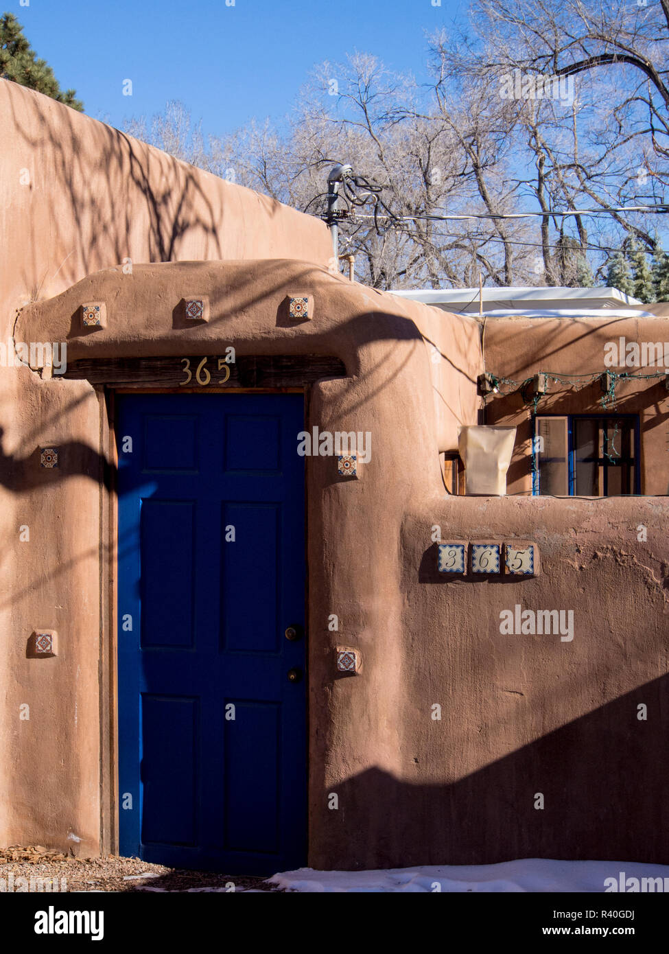 USA, New Mexico, Sant Fe, Adobe structure with protruding vigas and ...