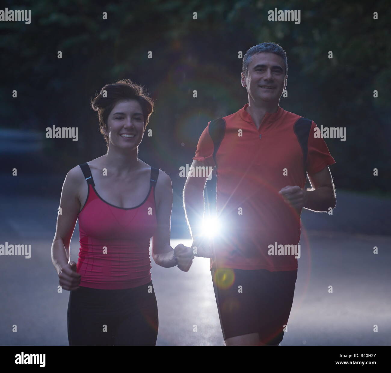 couple jogging at early morning Stock Photo - Alamy