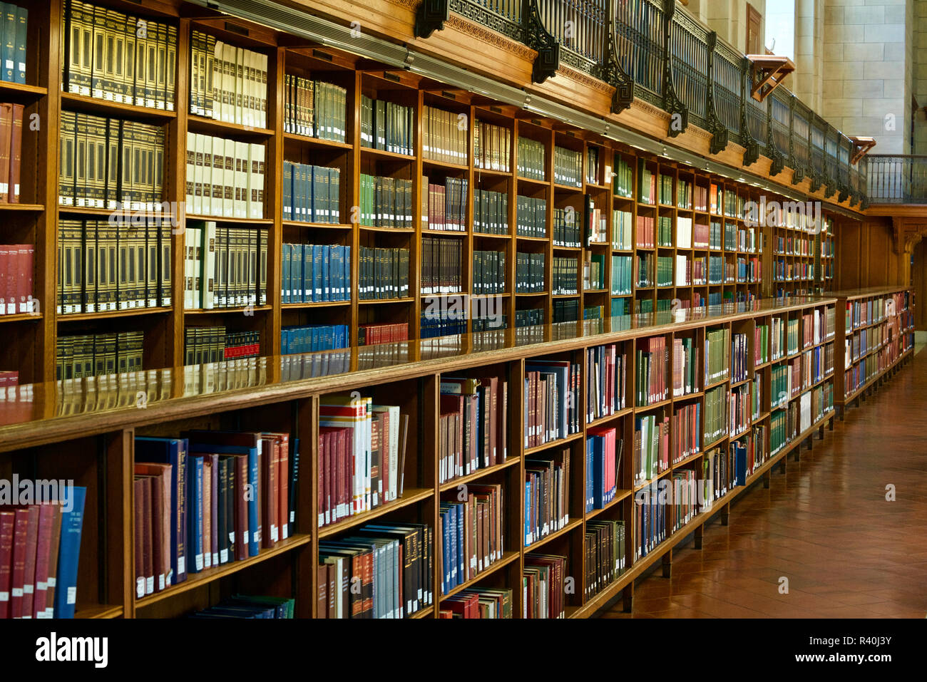 USA, New York, NYC. Shelves inside Public Library main readers' room ...