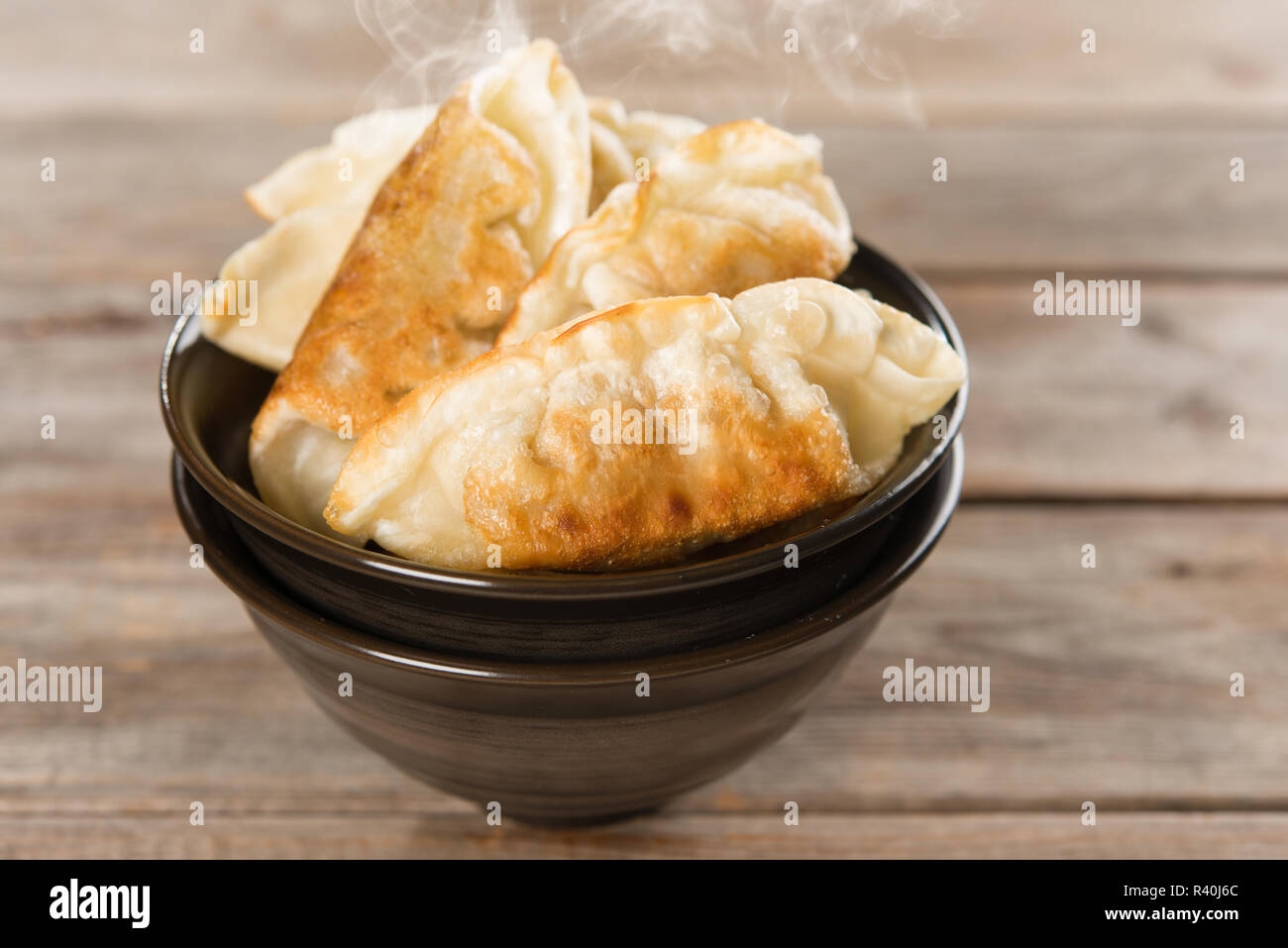 Popular Chinese food pan fried dumplings Stock Photo - Alamy