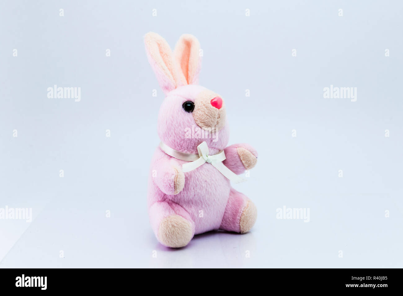 Funny knitted rabbit toy isolated on white background Stock Photo - Alamy