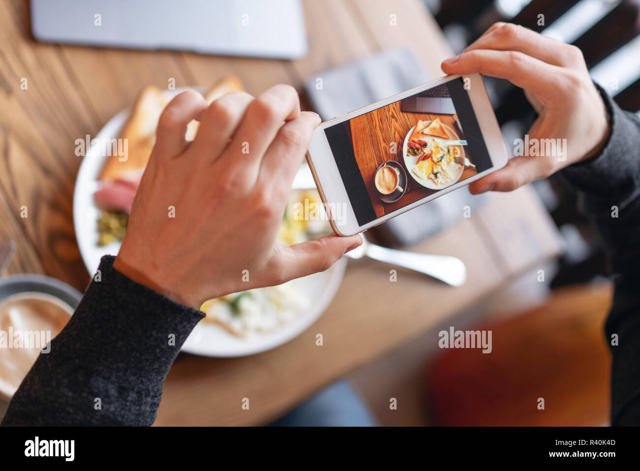 Blogger takes pictures of the Breakfast on the smartphone. Concept of ...