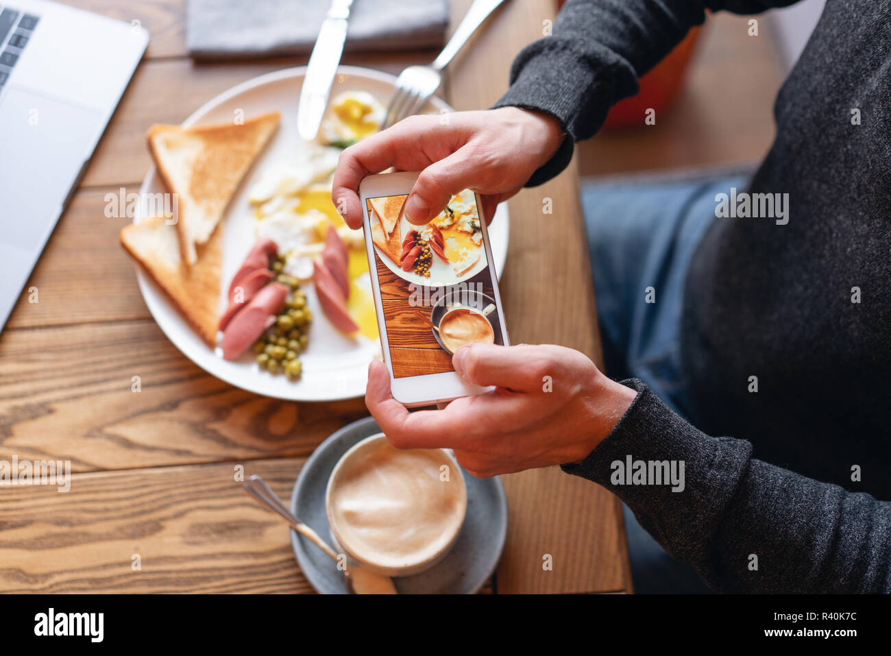 Blogger takes pictures of the Breakfast on the smartphone. Concept of ...