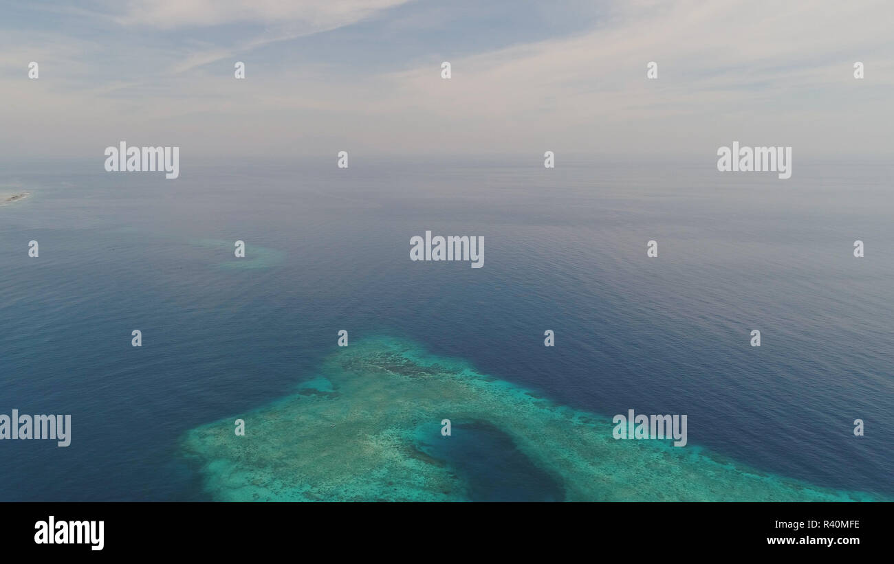 seascape aerial view coral reef, atoll with turquoise water in sea ...