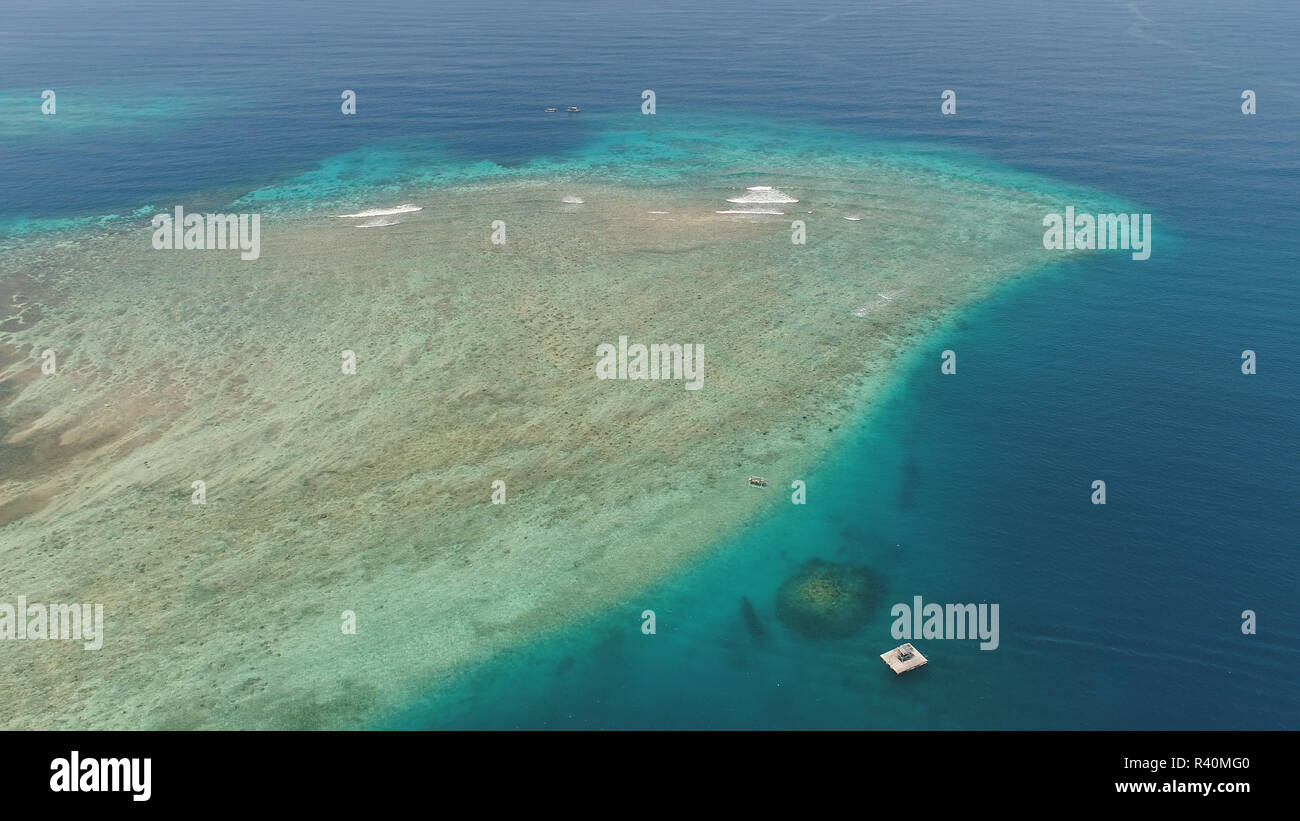 seascape aerial view coral reef, atoll with turquoise water in sea ...