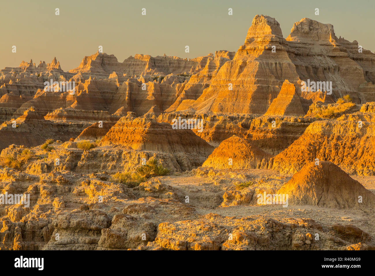 USA, South Dakota, Badlands National Park. Sunrise over eroded ...