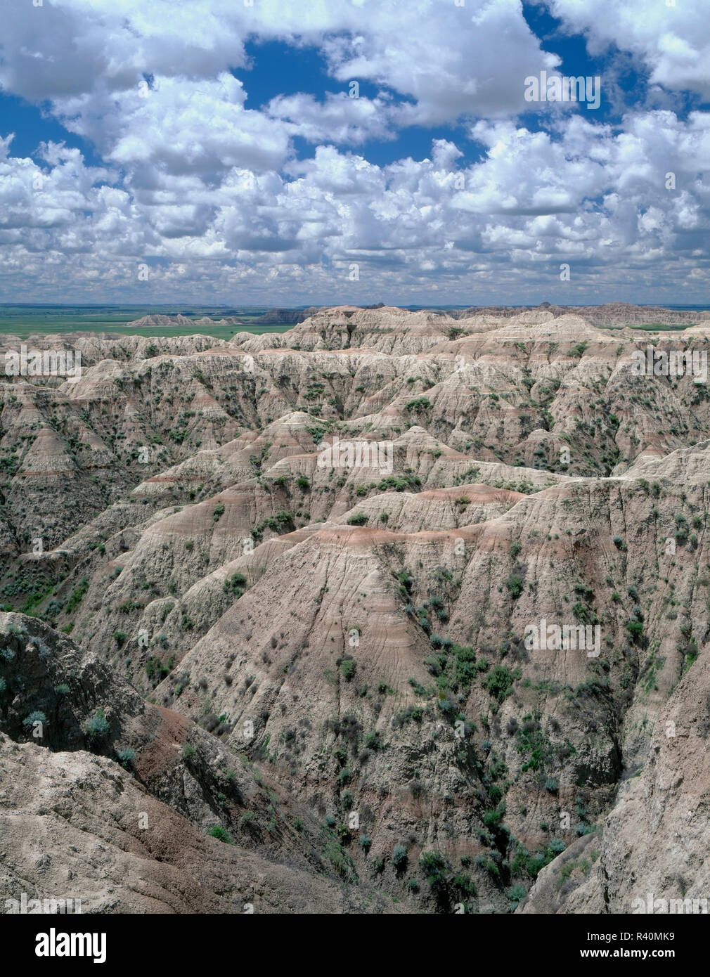 USA, South Dakota, Badlands National Park, North Unit, Cumulus clouds ...