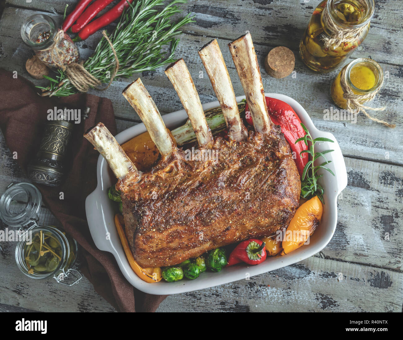 Grilled roasted rack of veal lamb chops with vegetables in ceramic ...
