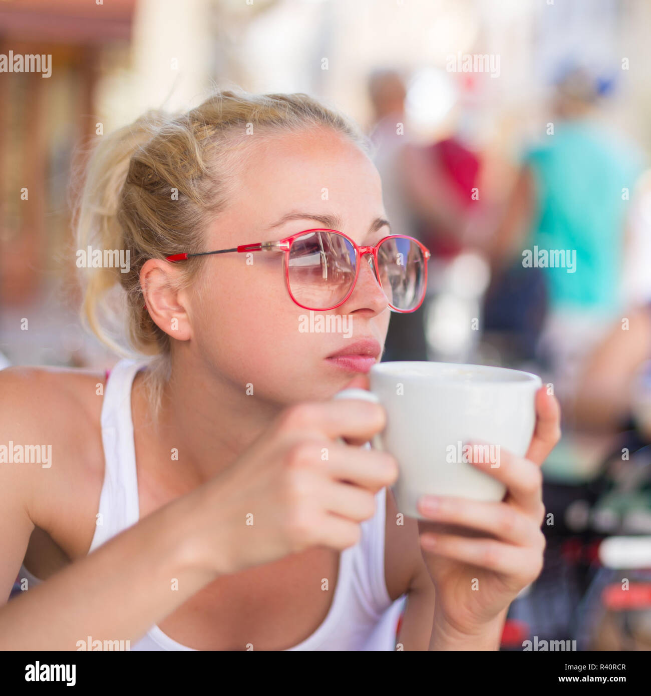 Woman drinking coffee outdoor on street Stock Photo - Alamy