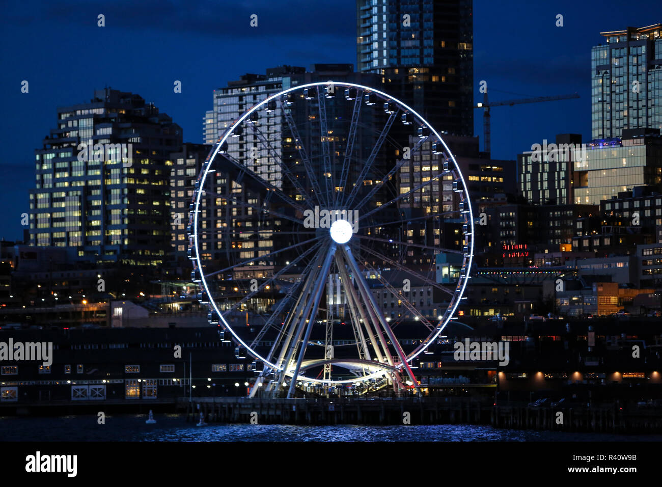 Seattle, Washington State. Waterfront Ferris wheel is lit up at night ...