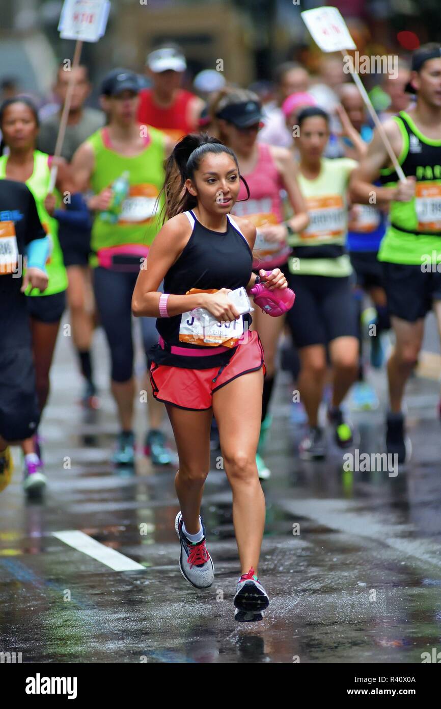 Chicago, Illinois, USA. Woman runner among a seas of competitors during ...