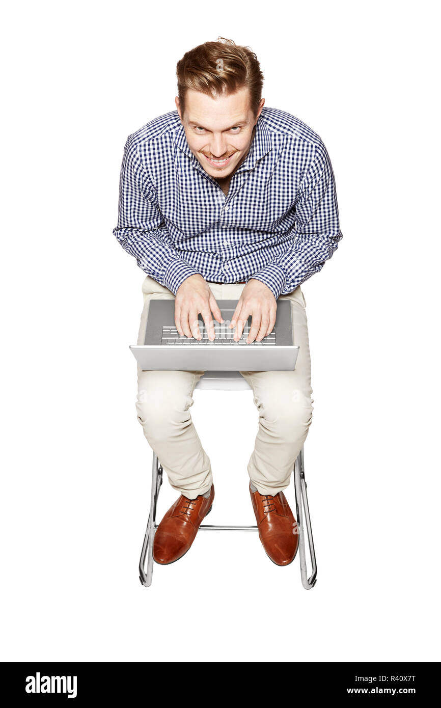 Happy man working on a computer Stock Photo - Alamy