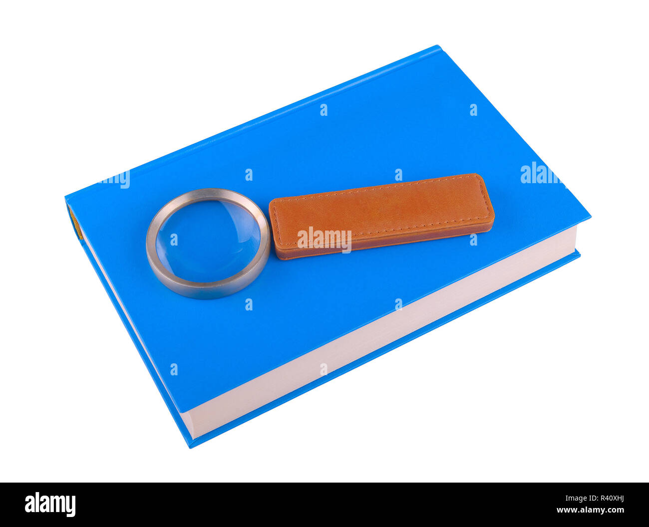 Magnifying glass lying on the book Stock Photo - Alamy