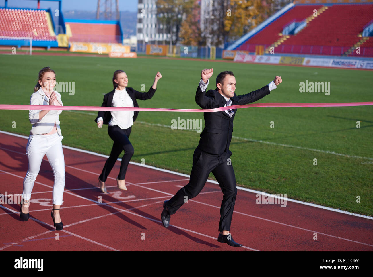 business people running on racing track Stock Photo - Alamy