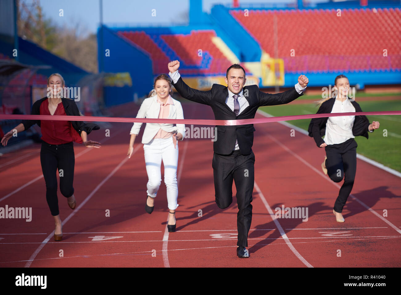 business people running on racing track Stock Photo - Alamy