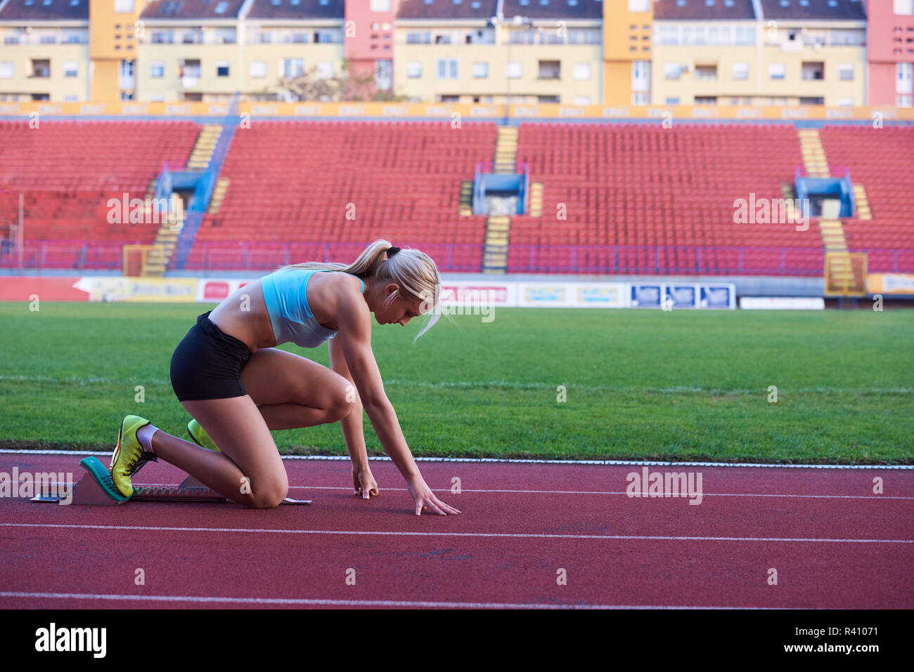 pixelated design of woman sprinter leaving starting blocks Stock Photo ...