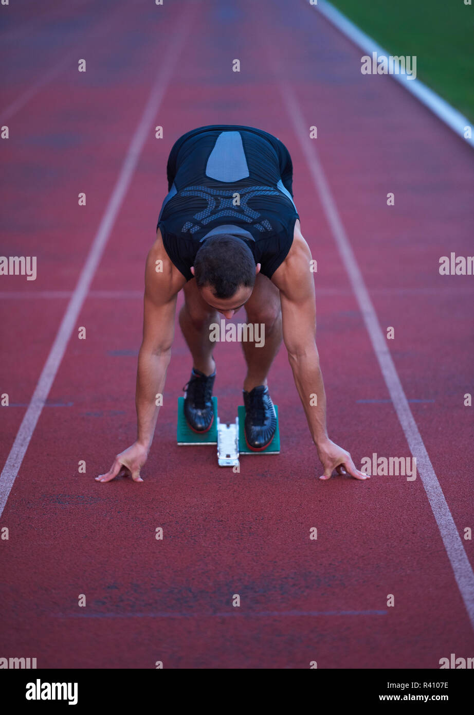 Athletic man start Stock Photo - Alamy